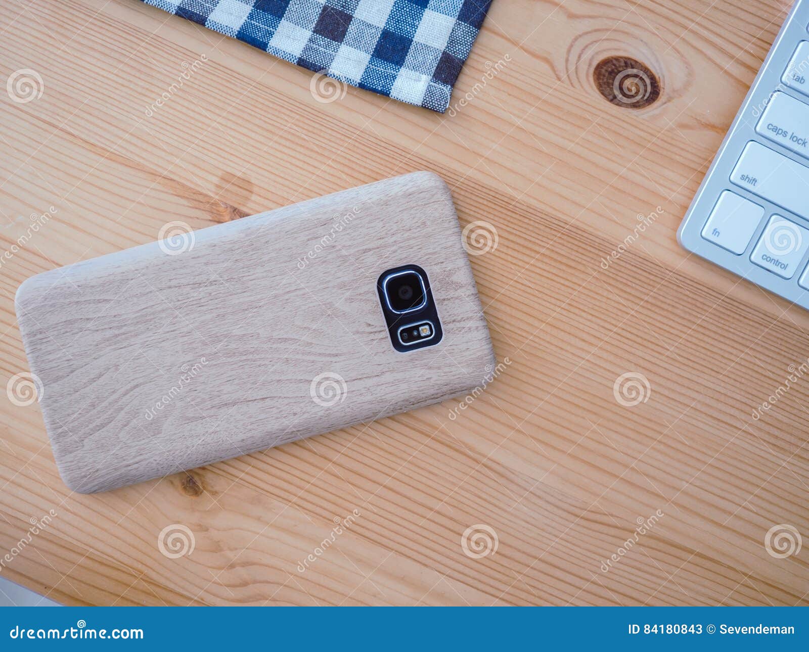 Smartphone on wooden desk. stock image. Image of internet - 84180843