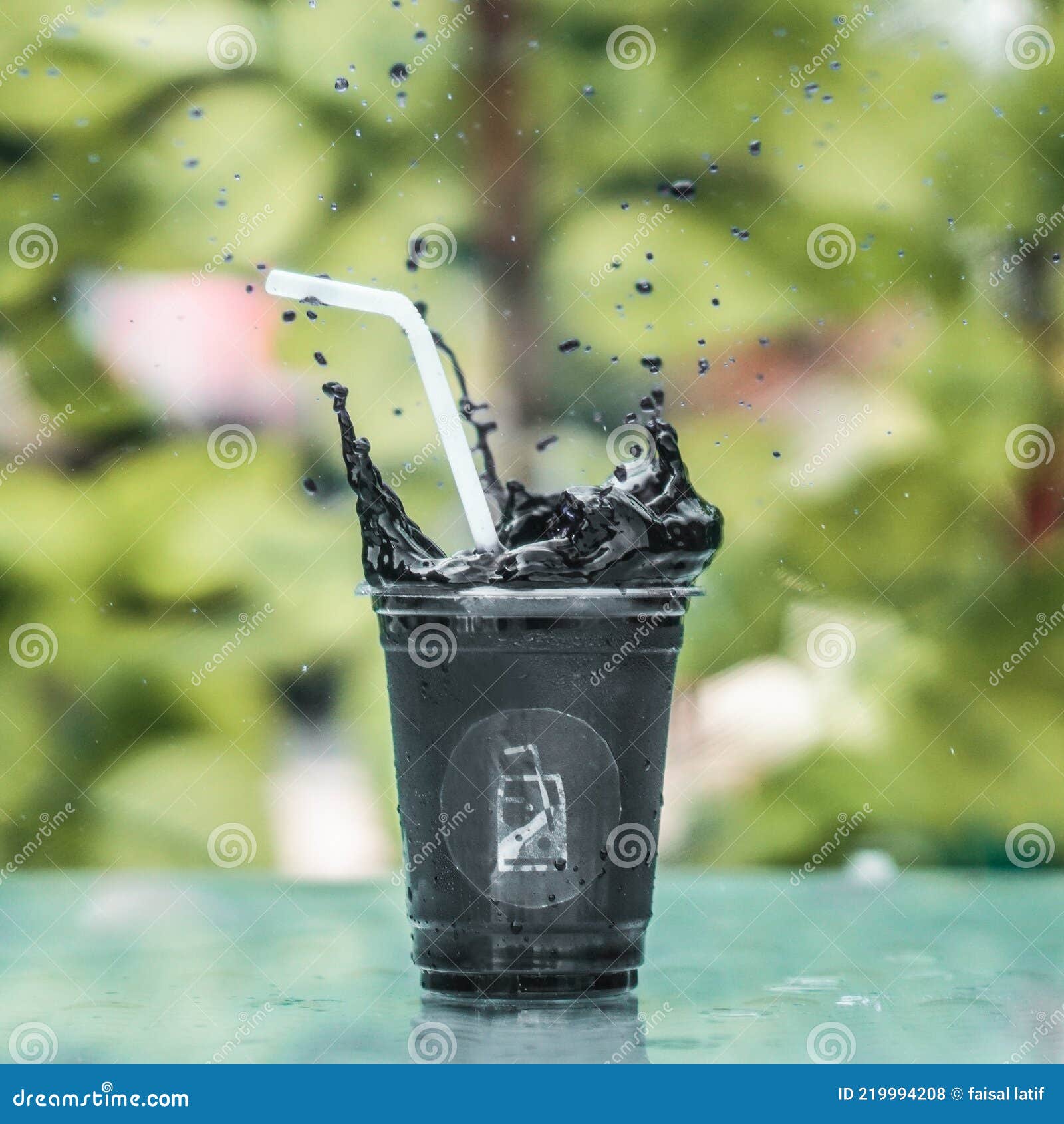 Smashed Black Chocolate in a Glass and Dropping Out Stock Photo - Image ...