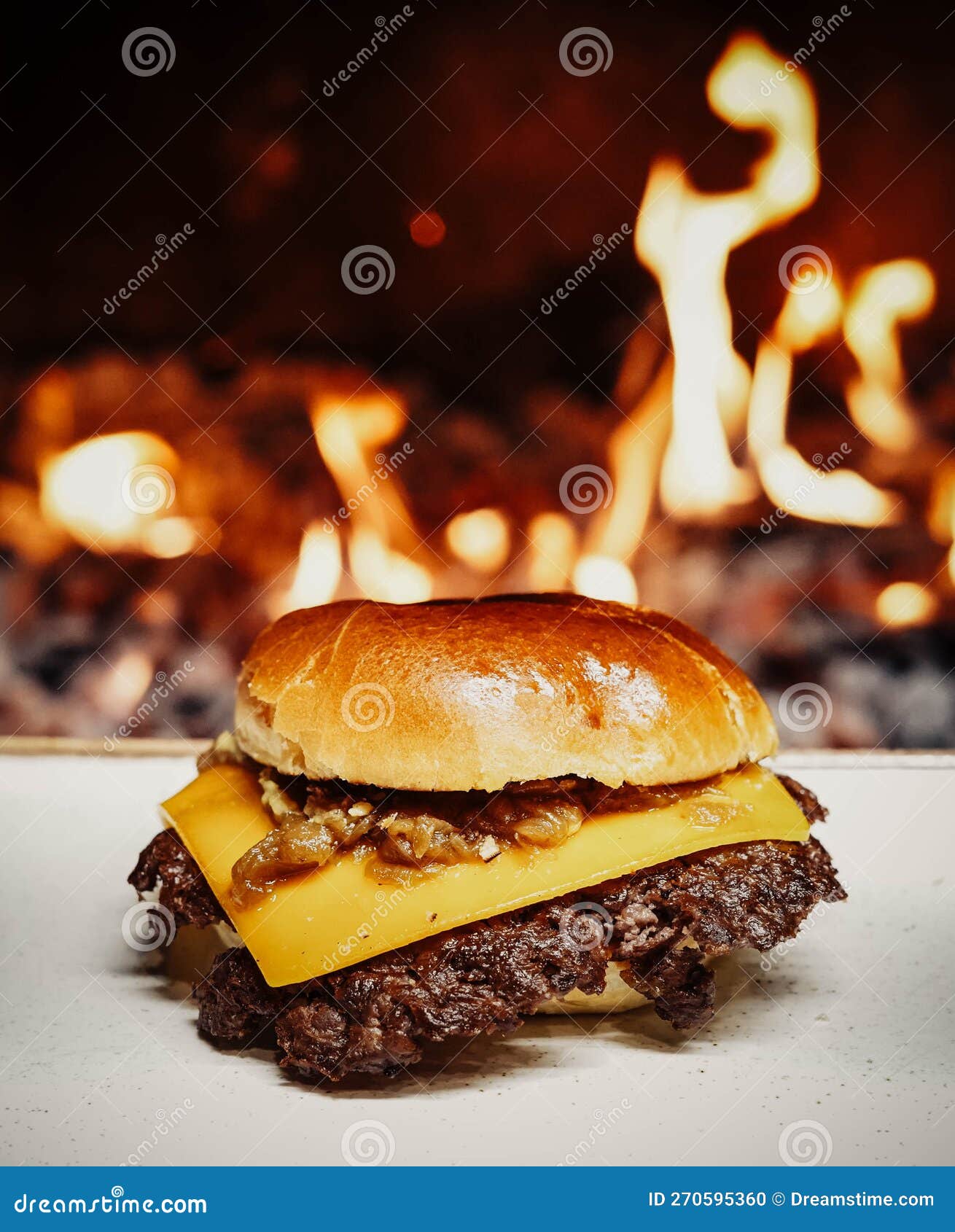Smashed Cheeseburger on a Wooden Table in Front of a Fireplace. Stock ...