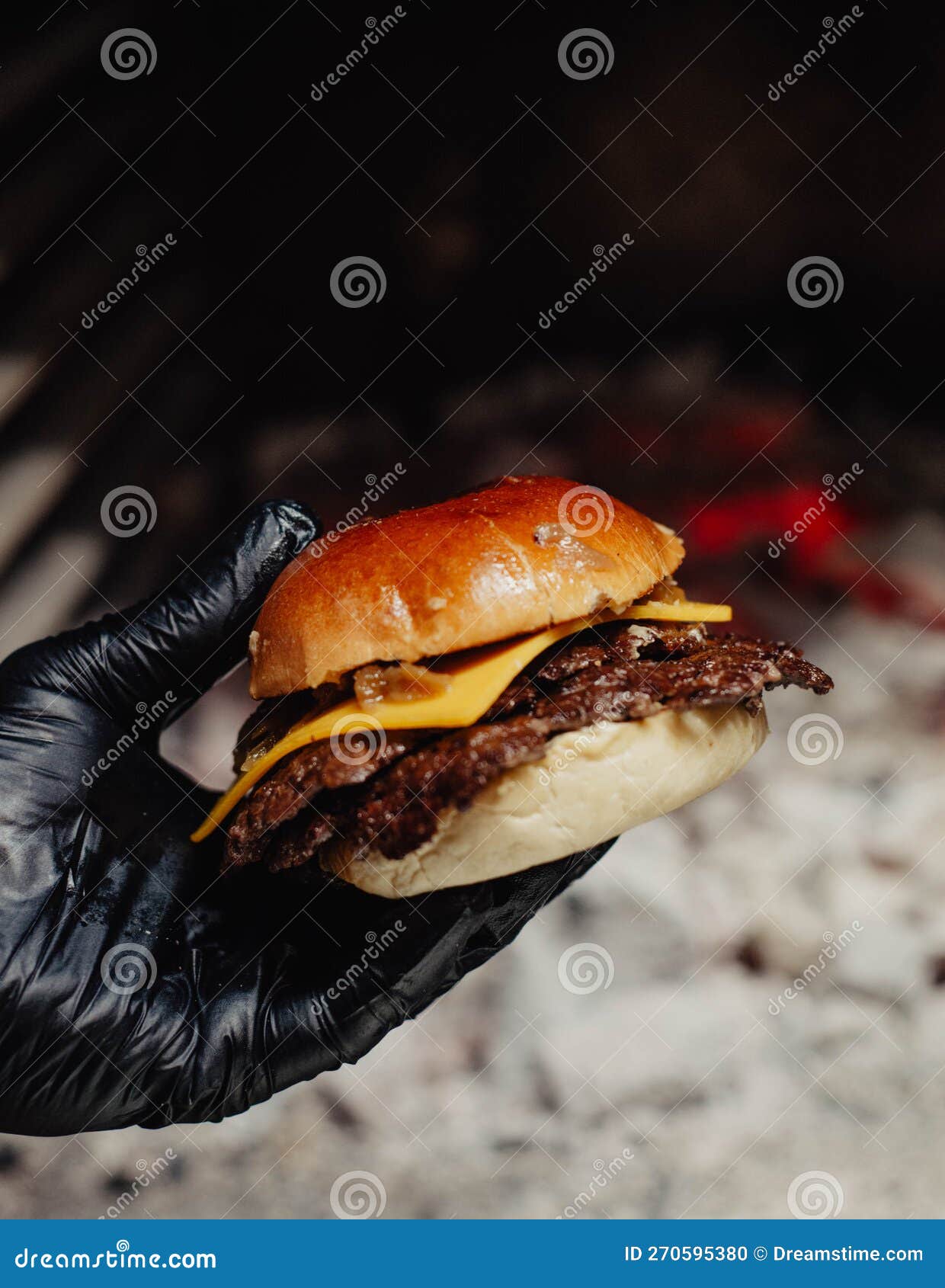 Smashed Cheeseburger on a Wooden Table in Front of a Fireplace. Stock ...