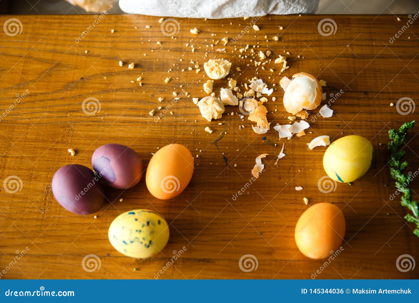 A Smashed Egg is Laying on a Table beside Some Painted Eggs. Stock ...