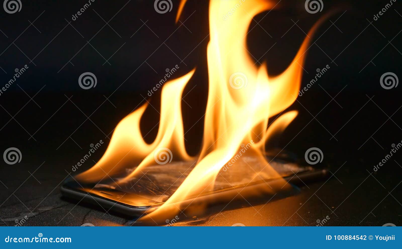 Smashed Smartphone is Burning on a Table Stock Photo - Image of crashed ...