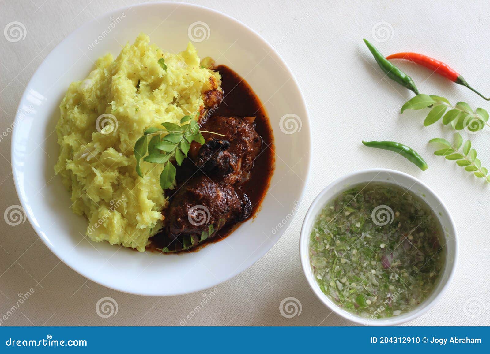 Mashed Tapioca Served With Pomfret Fish Curry. Boiled And Strained ...