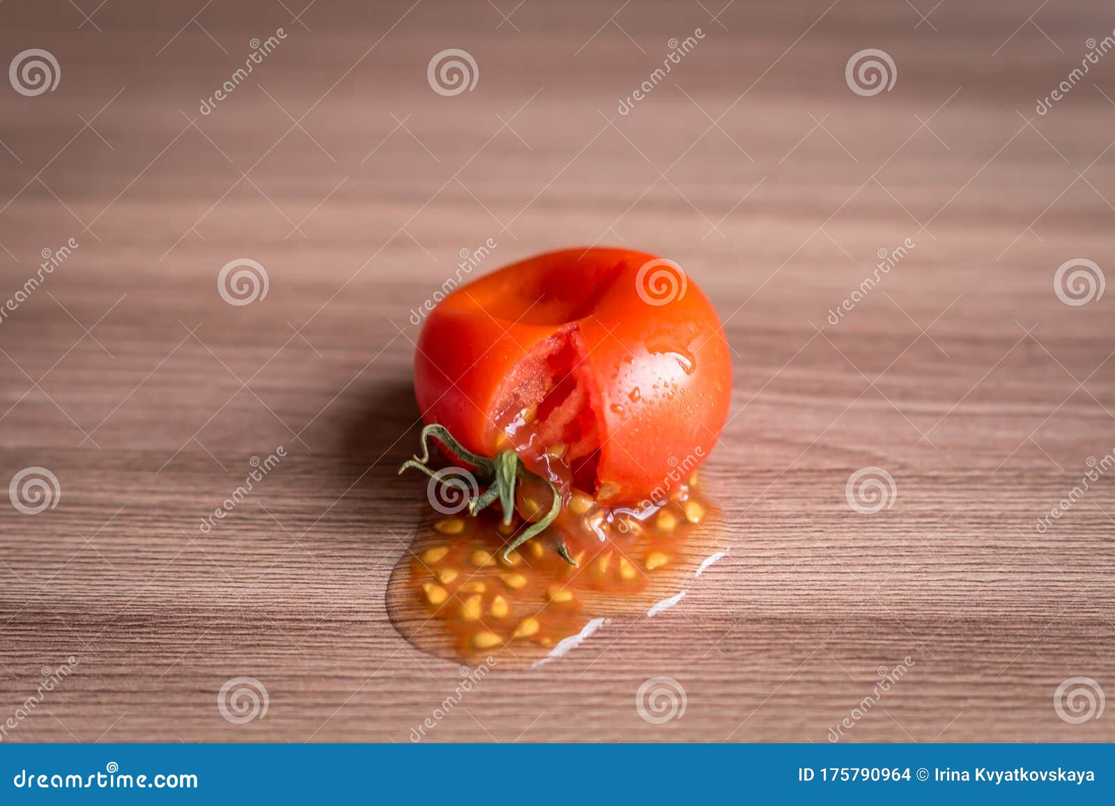 Smashed Tomato on Wooden Table Stock Photo - Image of drop, splatter ...
