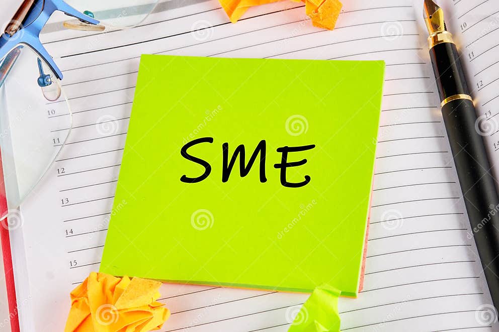 SME, Small and Medium Enterprise. on a Light Green Sticker Lying on the ...