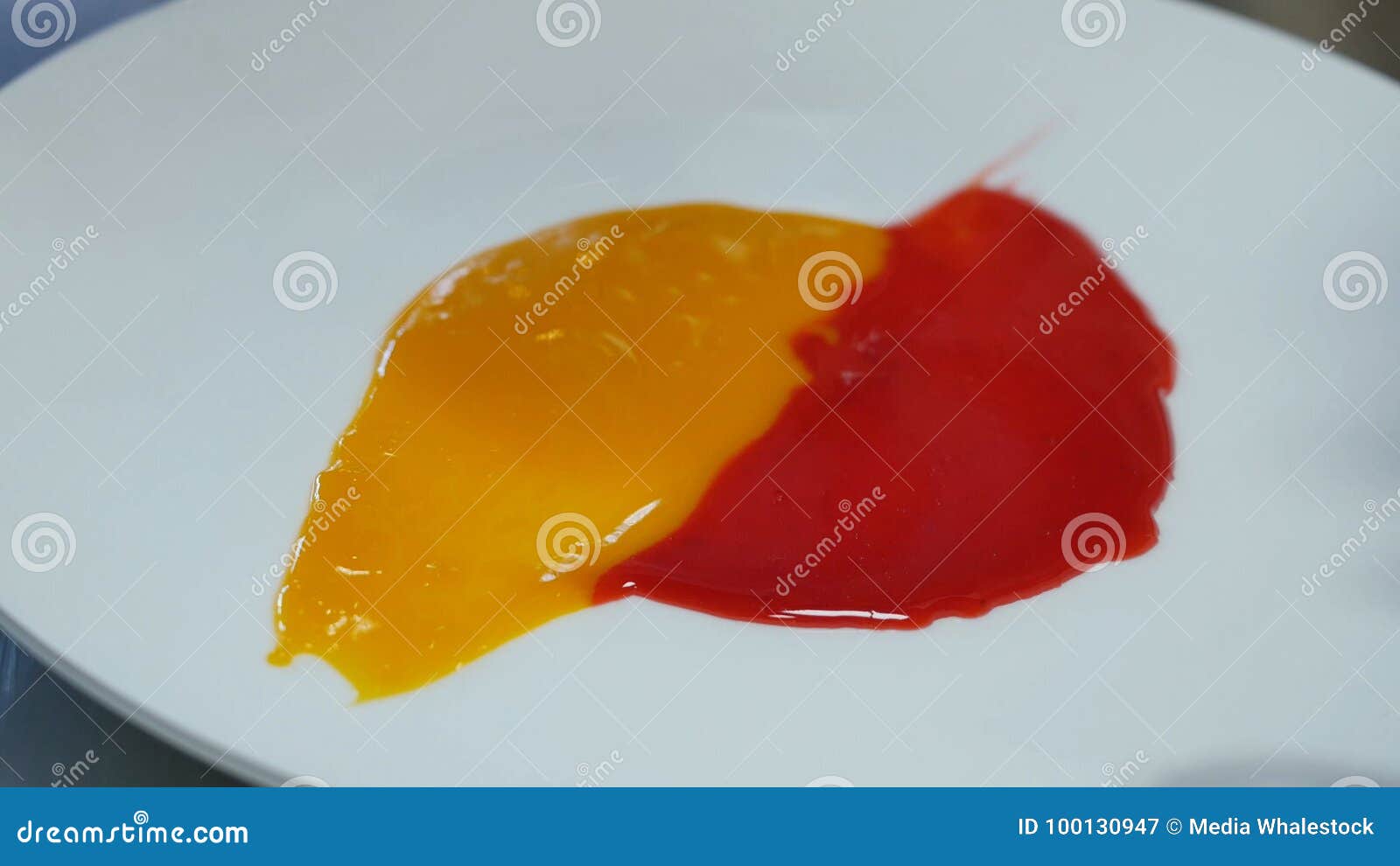 Smearing Jam on a Plate. Two Kinds of Jam Smeared on the Plate with a ...