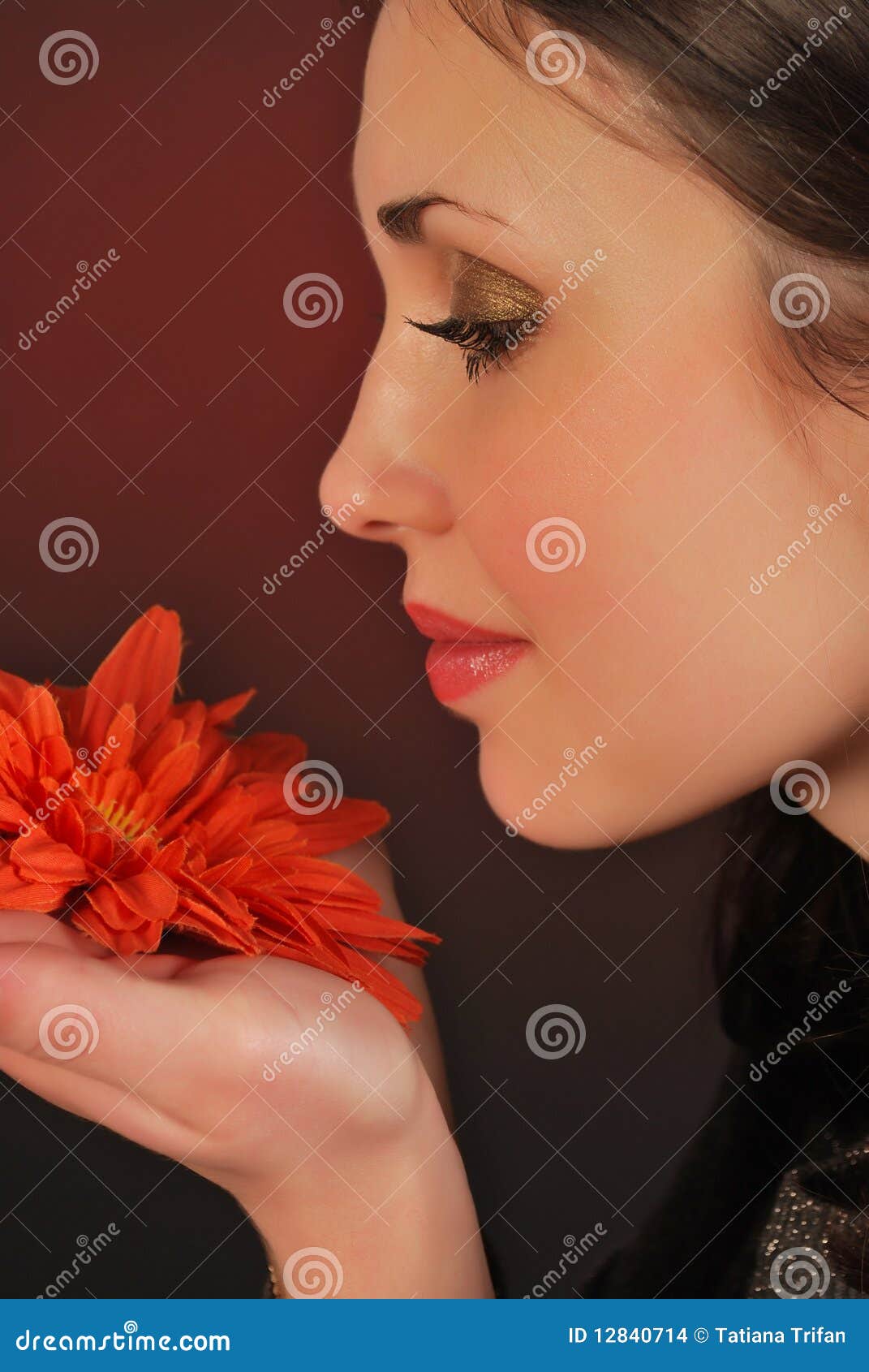 Smelling the flower stock photo. Image of female, head - 12840714
