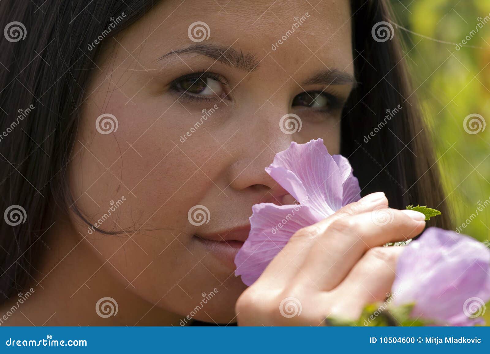 Smelling the flowers stock photo. Image of beauty, girl - 10504600