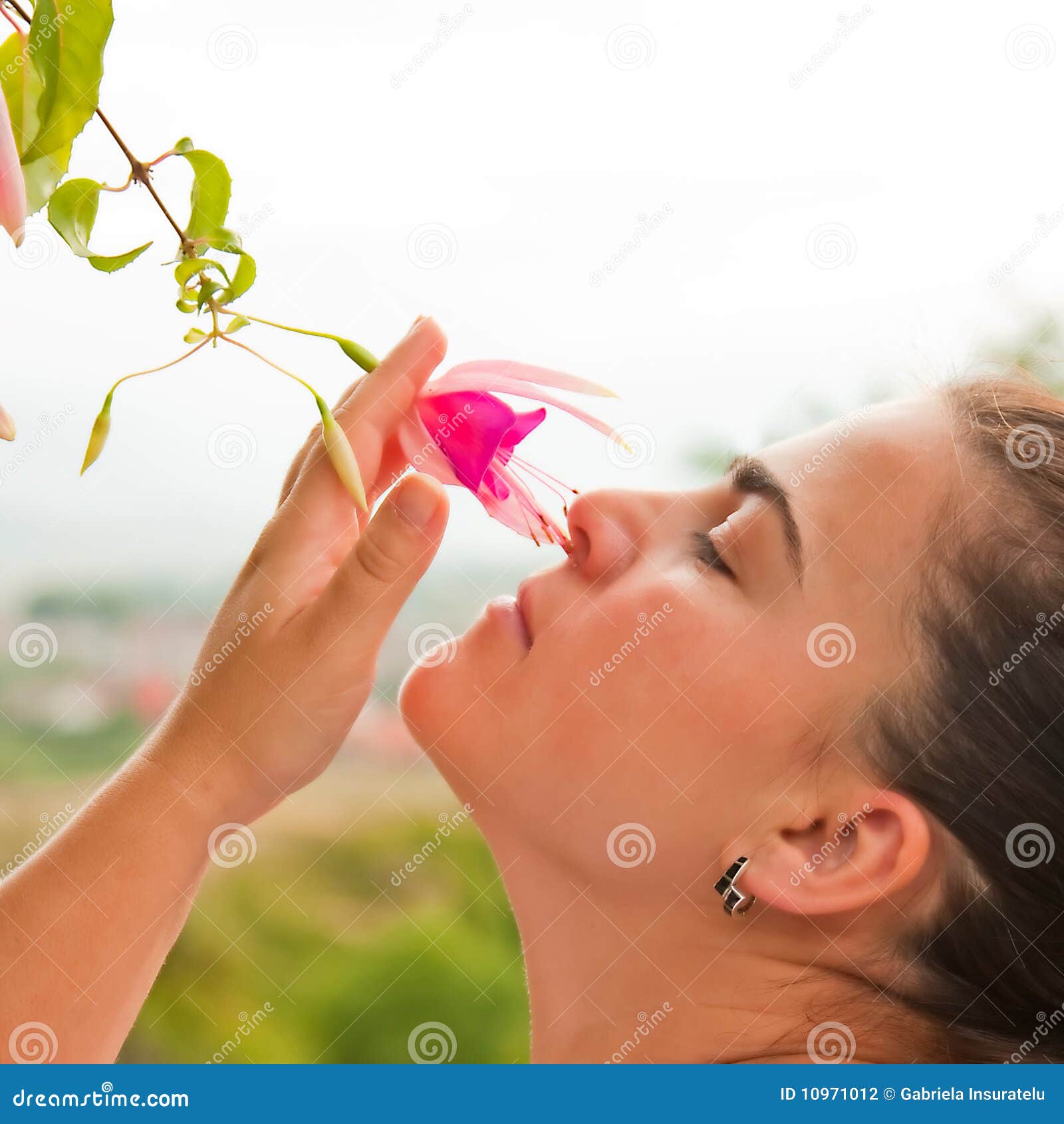 Smelling flowers stock photo. Image of outside, emotion - 10971012