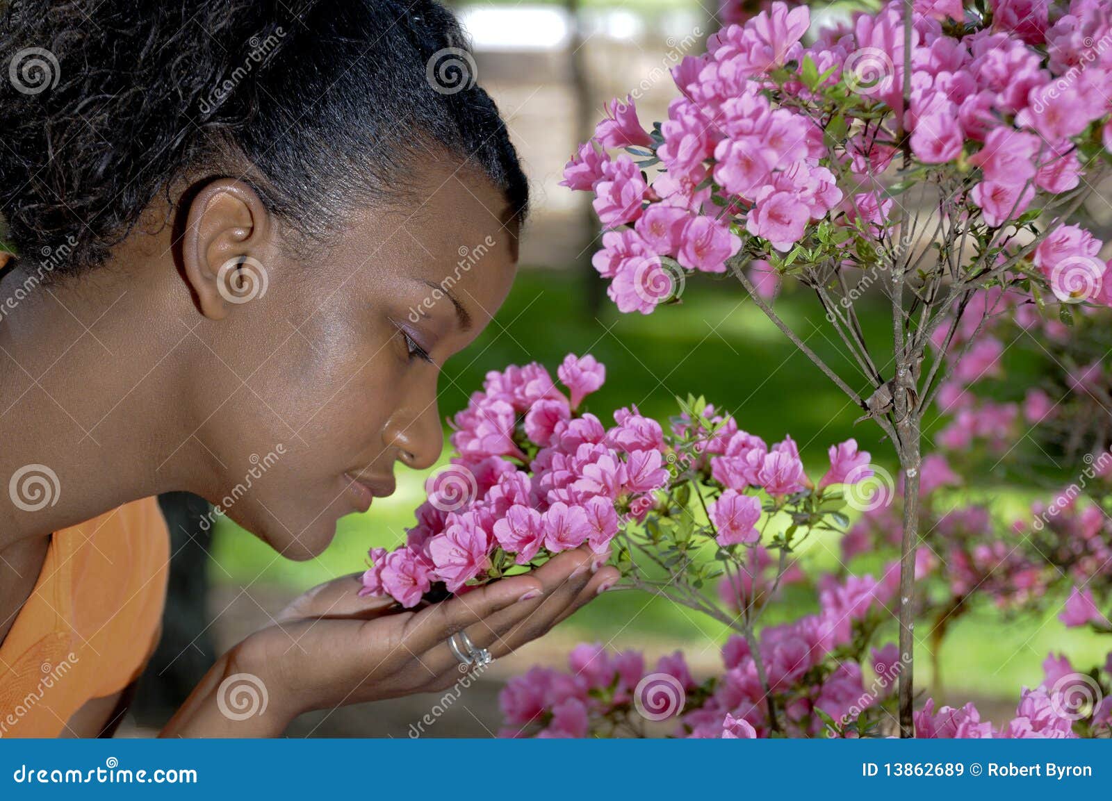 Smelling Flowers stock image. Image of american, happy - 13862689