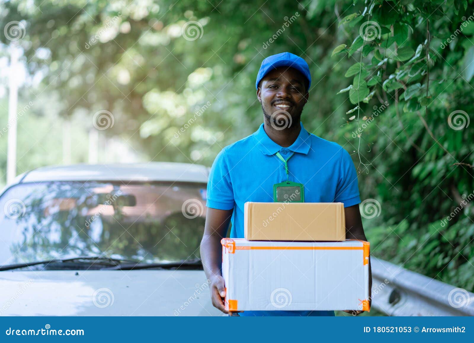 Smile African Man Postal Delivery Courier Man in Front of Car ...