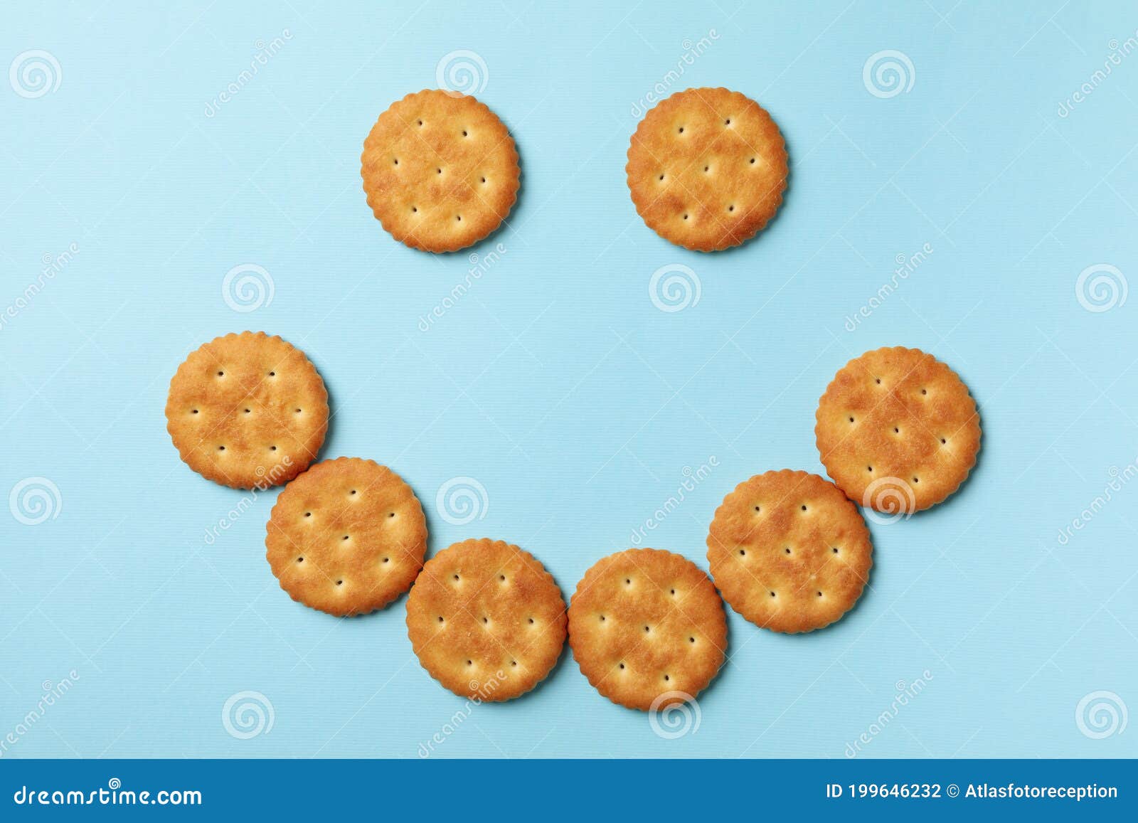 Smile Face Made of Cracker Biscuits on Blue Background Stock Photo ...