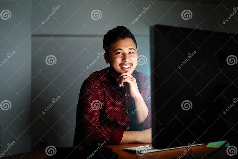 Smile, Man and Computer at Night in Office of Coding, Problem Solving and Software Design As ...