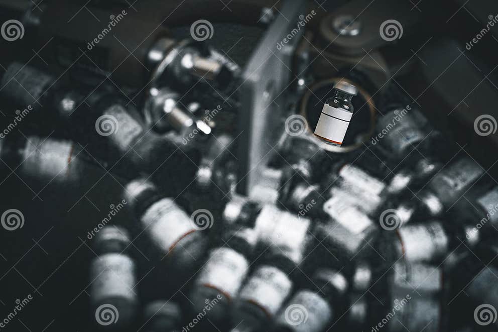 A Smile Vile is Reflected in the Glass of a Vintage Microscope in a ...