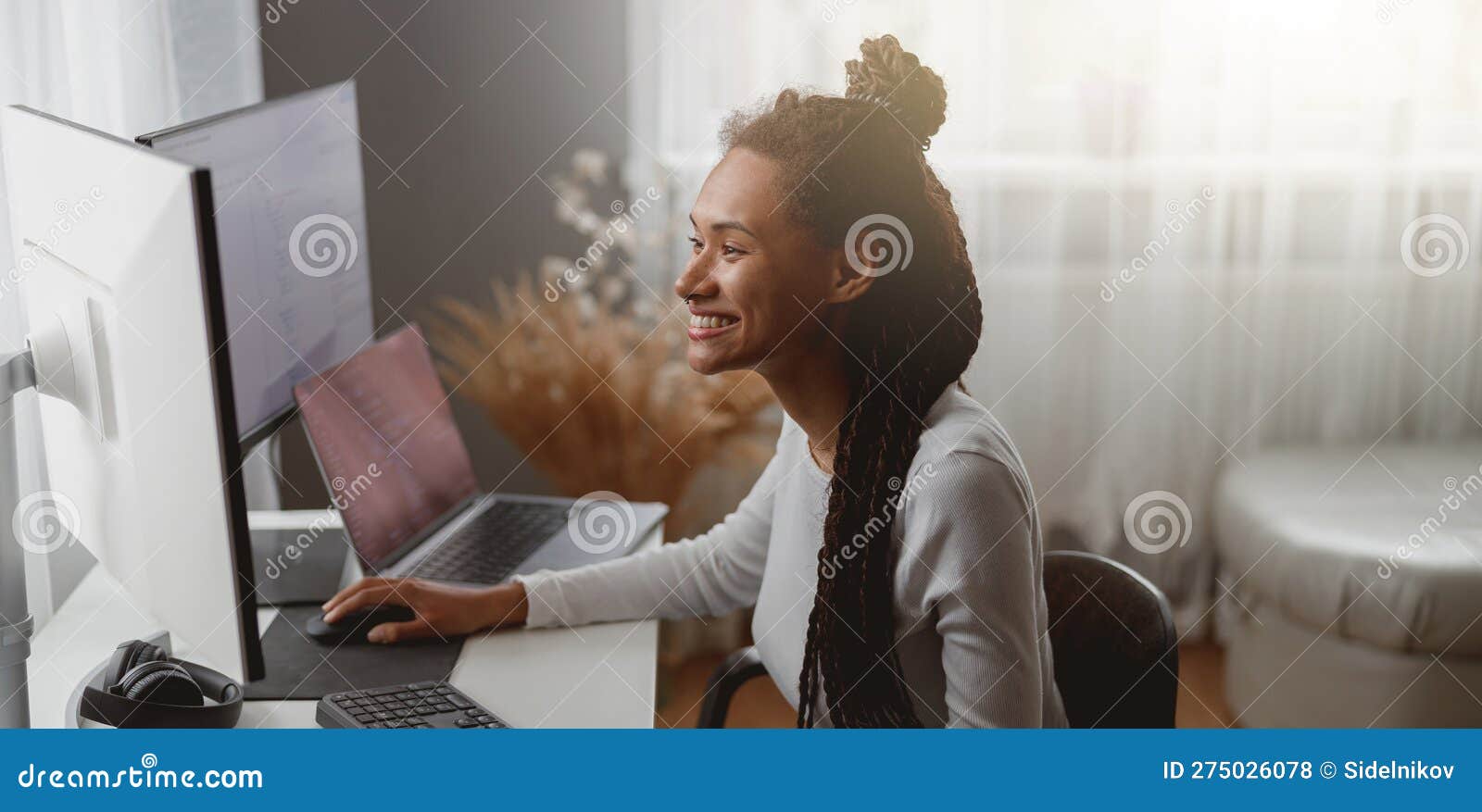 Smiled Cheerful Female Web Expert Sitting at Desk in Living Room Coding ... Smiled Cheerful Female Web Expert Sitting at Desk in Living Room Coding ...
