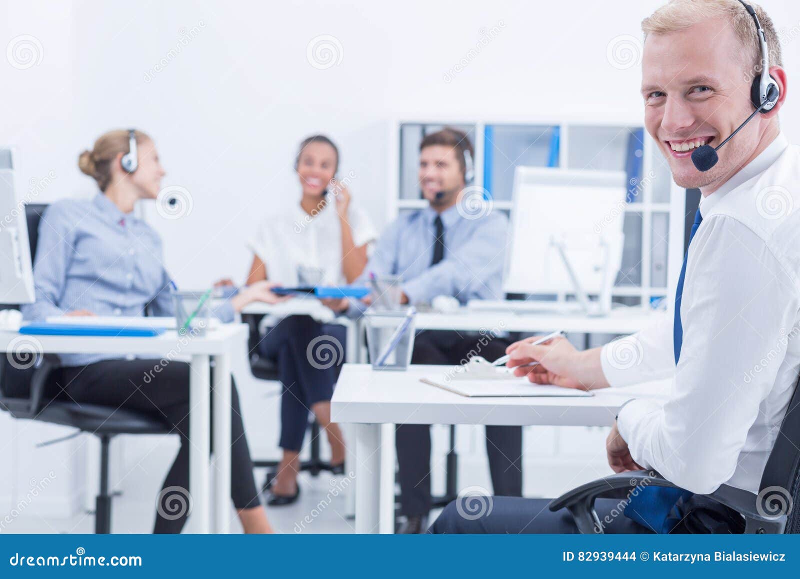 Smiled male telemarketer stock photo. Image of supplies - 82939444