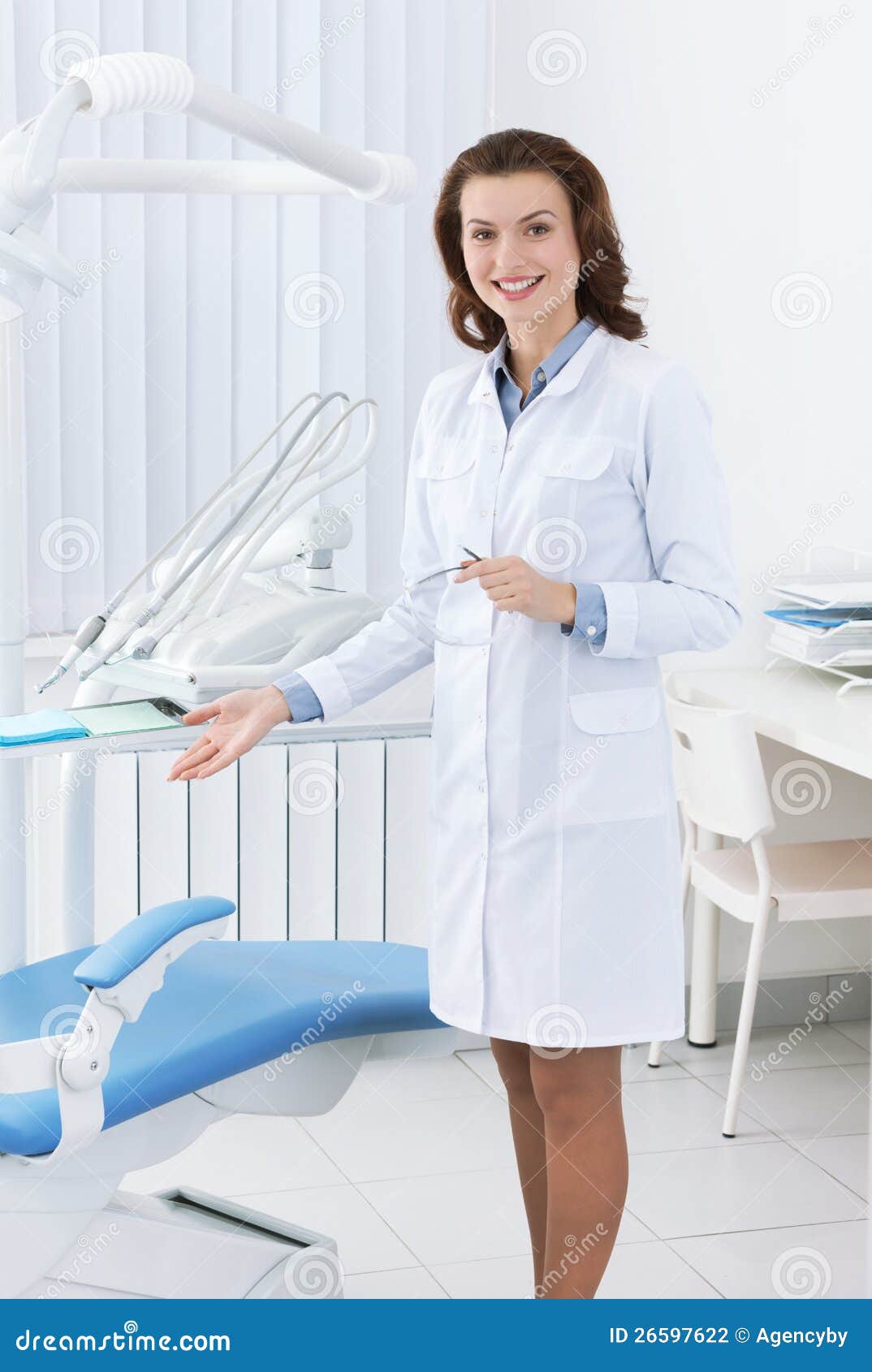 Smiley Assistant Shows the Dentist S Chair Stock Photo - Image of ...