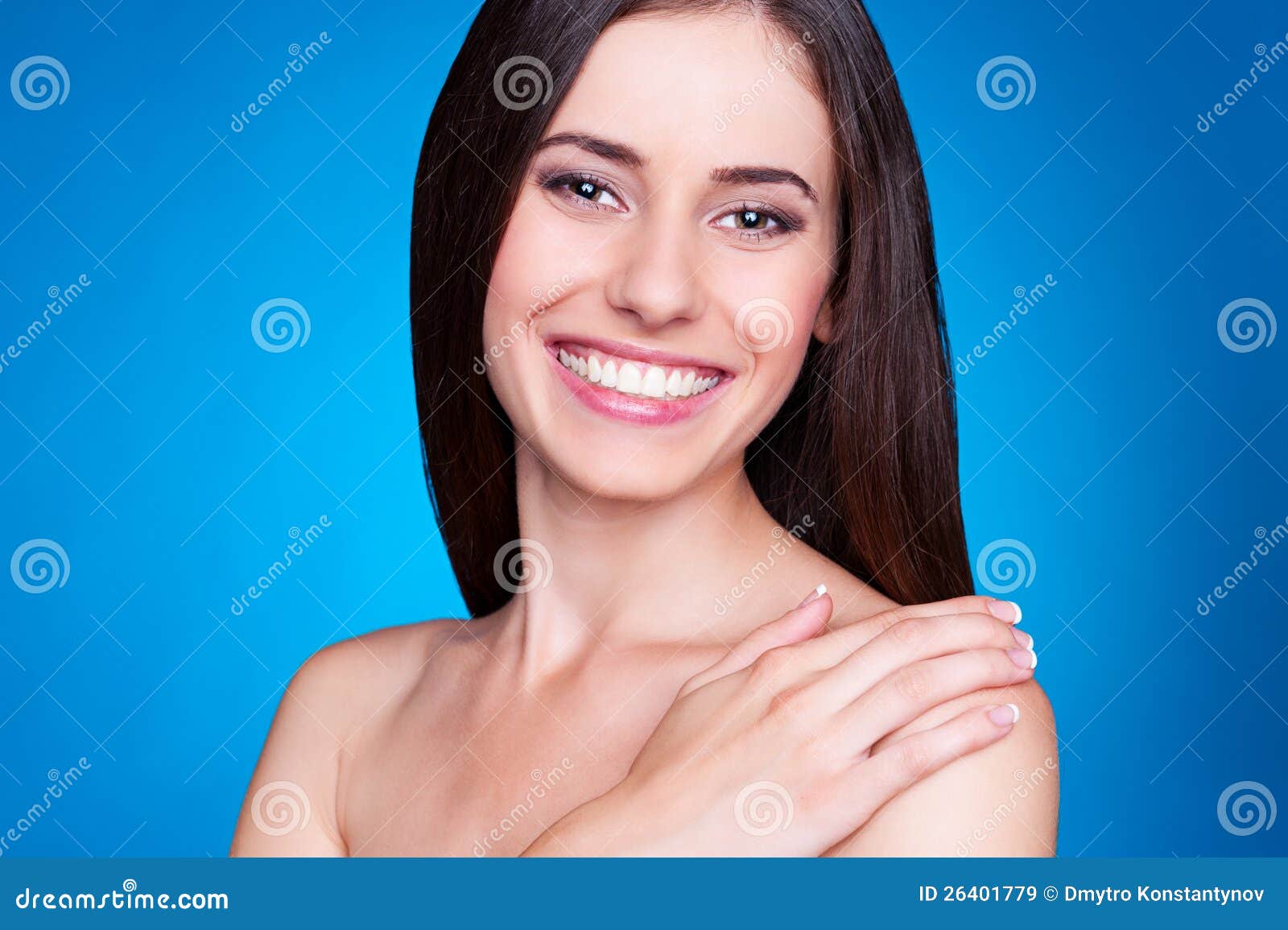 Smiley Brunette Lying On The Bed With A Telephone Royalty Free Stock