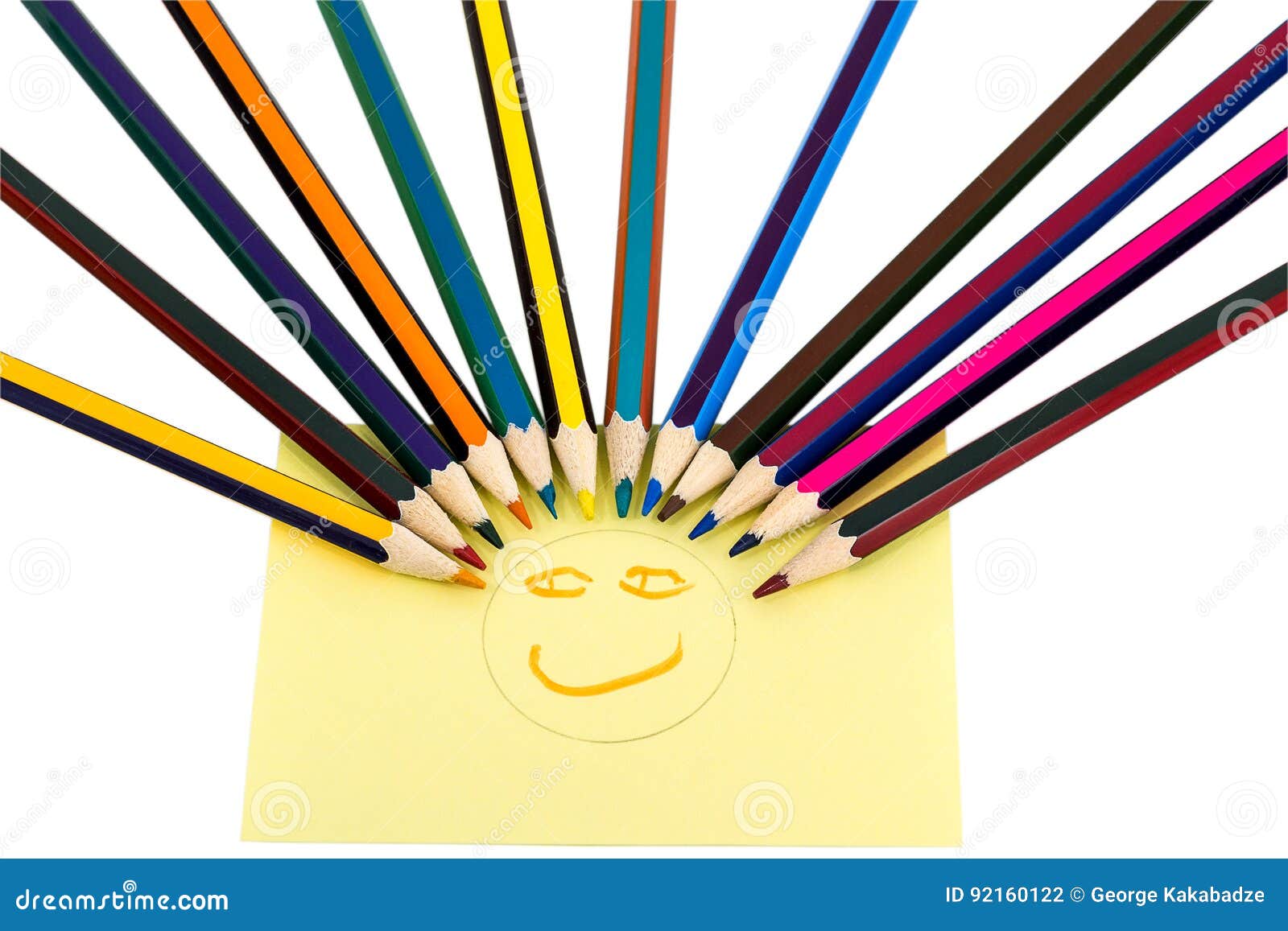 A Smiley from Colored Pencils and a Yellow Sticker with a Painted Face ...