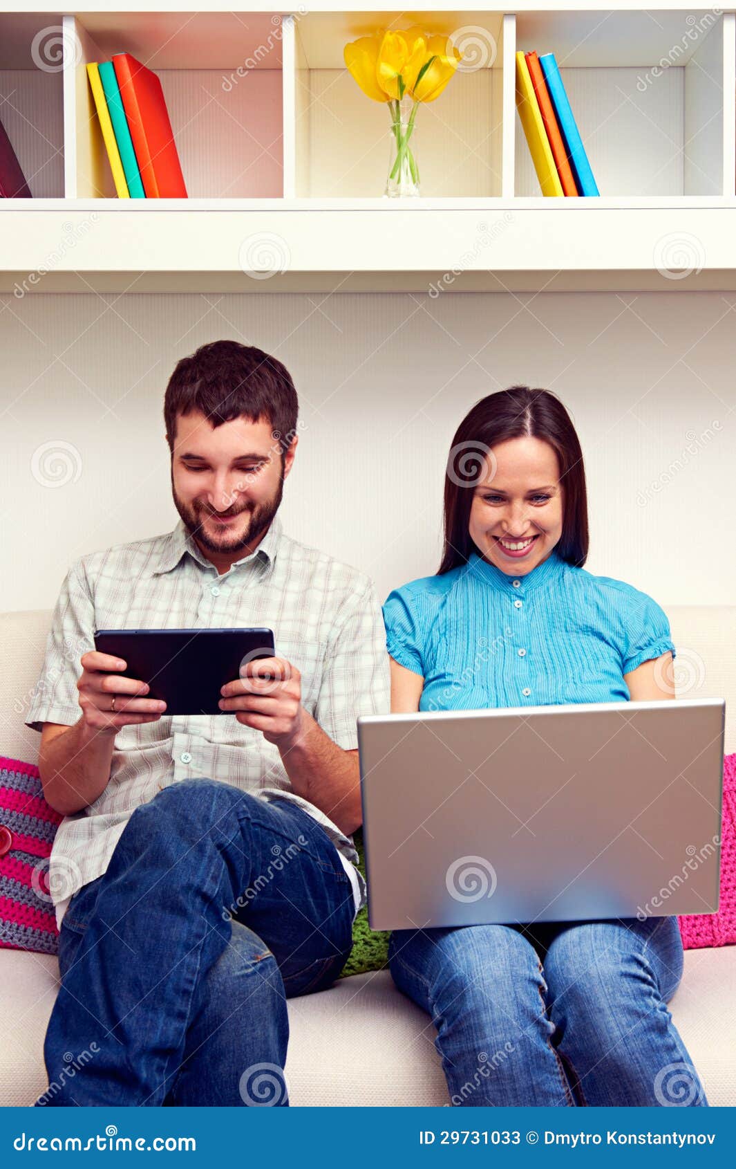 Couple Sitting on Sofa and Holding Computers Stock Image - Image of ...