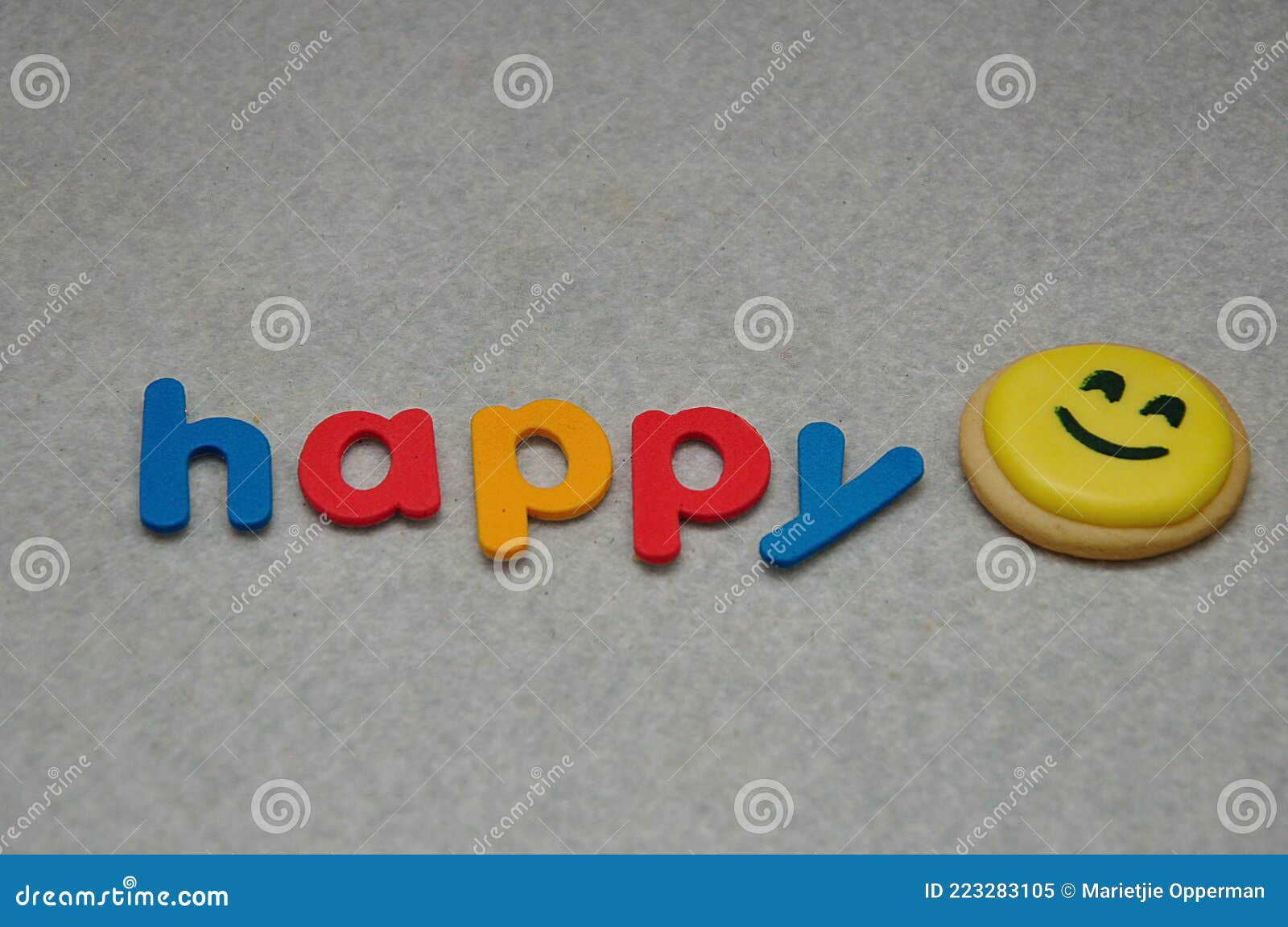 A Smiley Emoji Biscuit With The Word Happy Stock Photography ...