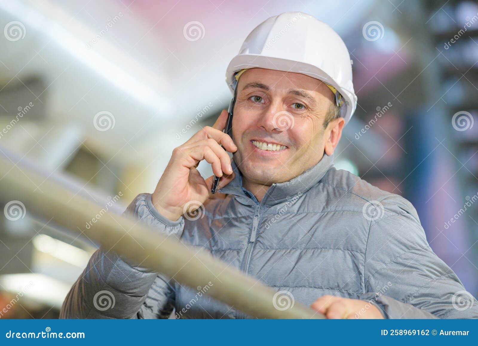 Smiley Engineer Holding Smart Phone Stock Photo - Image of phone ...