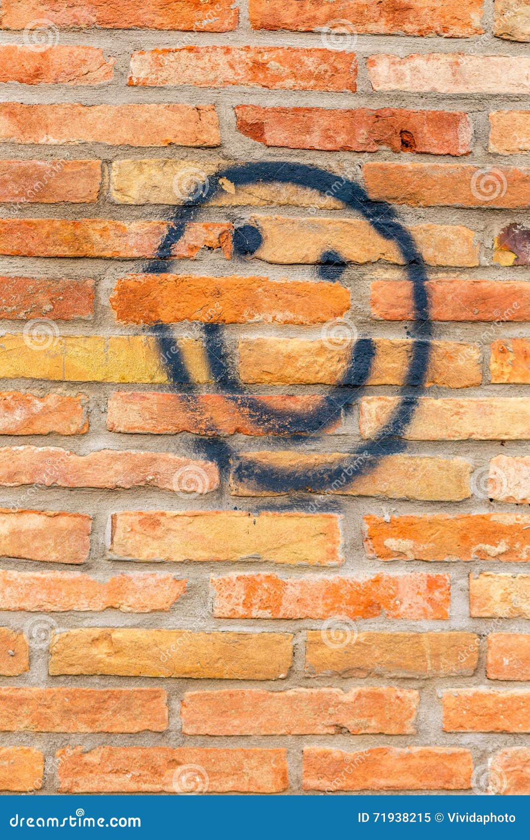 Smiley Head Brick Wall