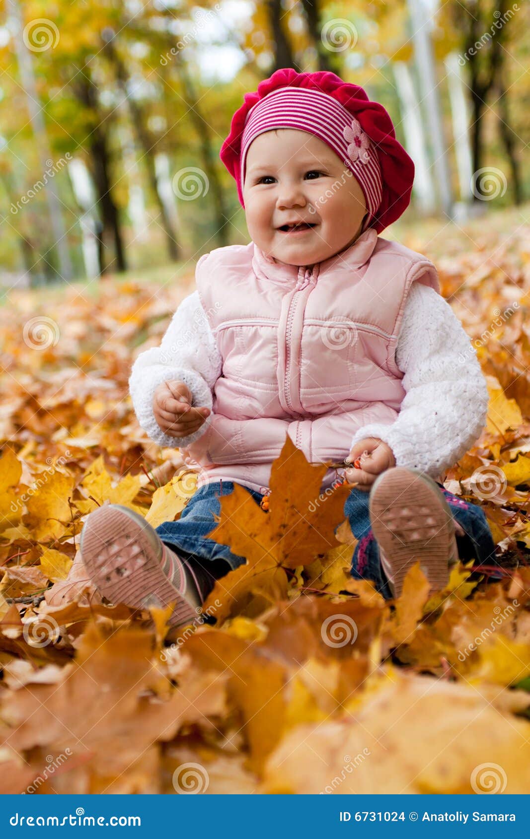 Smiley Girl On Yellow Leaves Stock Photo | CartoonDealer.com #6731024
