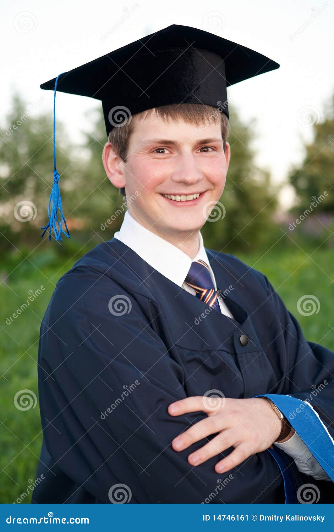 Graduate Student Woman In Cap Gown Looking Up At Bright Light Bulb ...