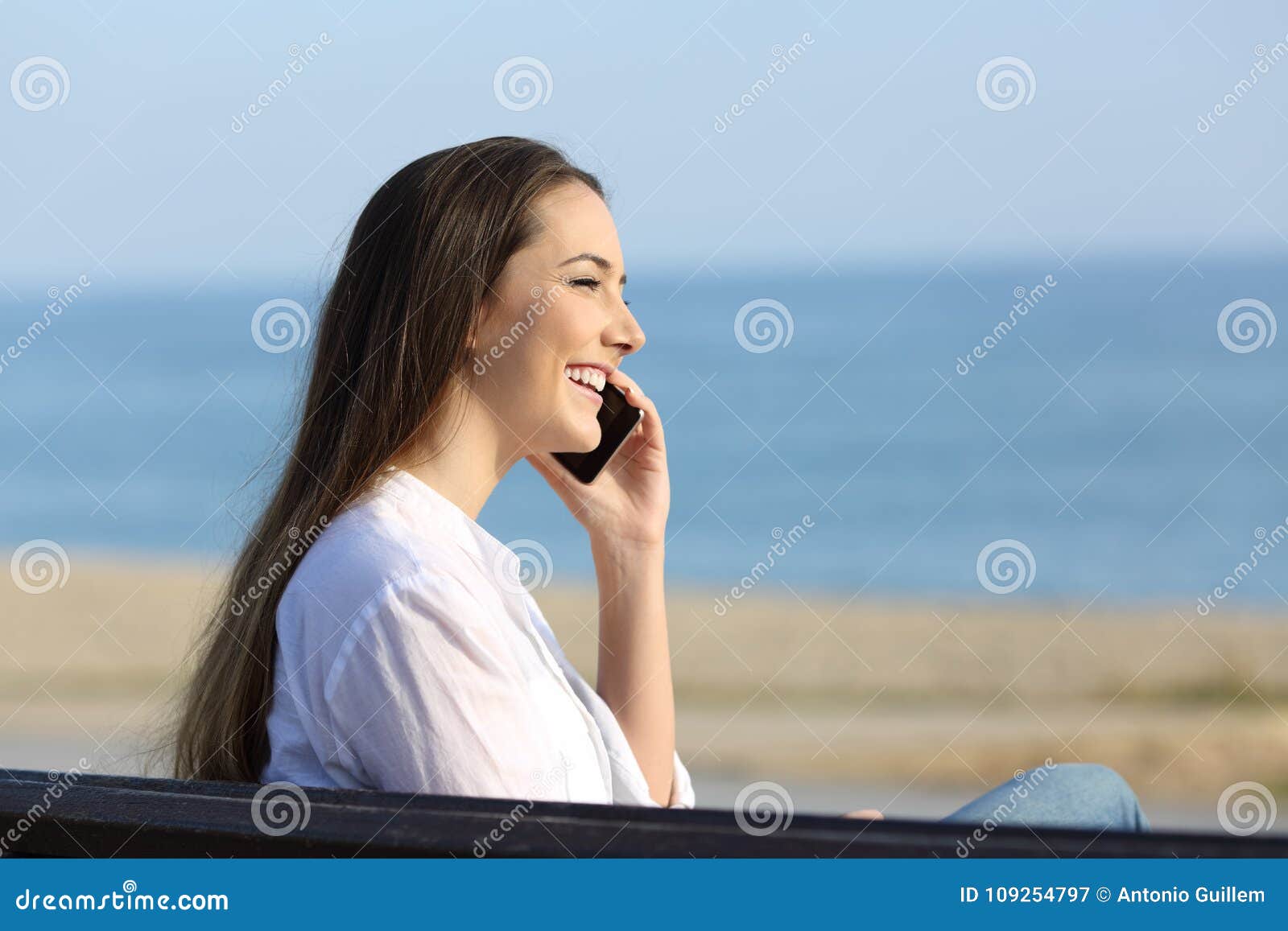Smiley Lady Talking on Phone on the Beach Stock Image - Image of casual ...
