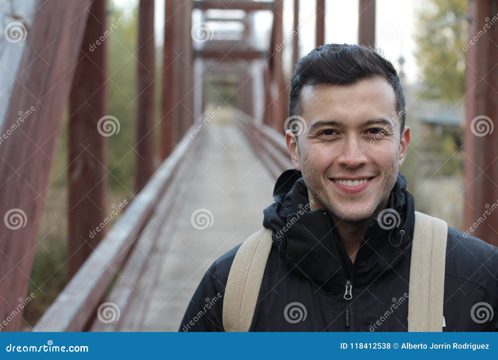 Smiley Male Walking through a Bridge Stock Photo - Image of activity ...
