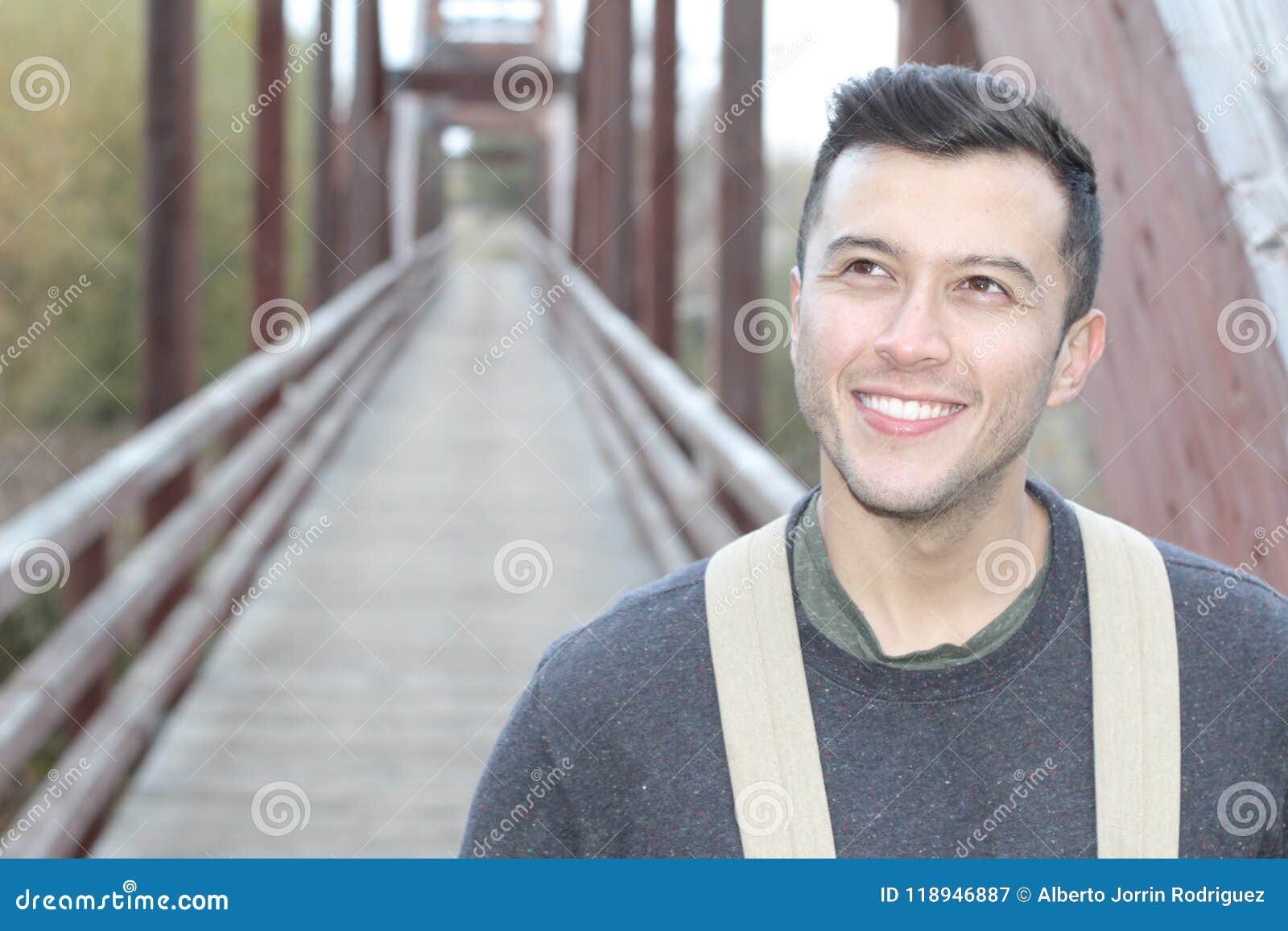 Smiley Male Walking through a Bridge Stock Image - Image of activity ...