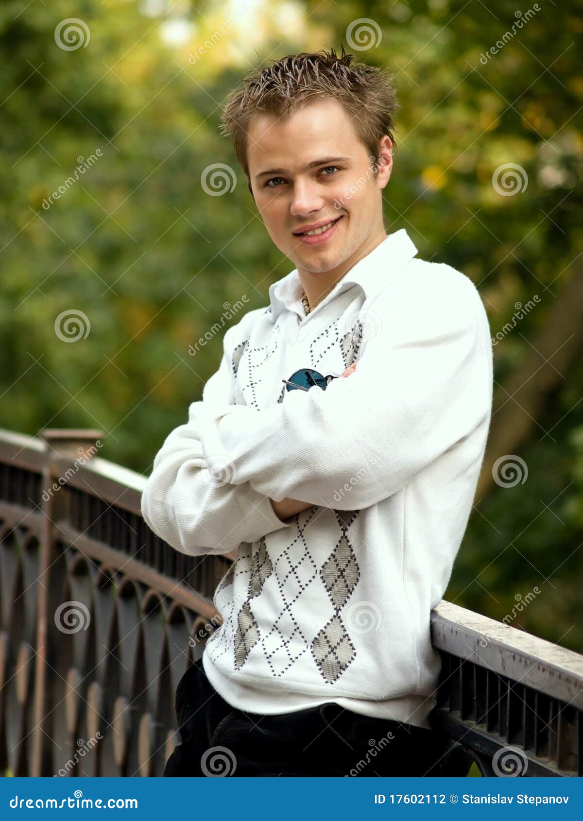 Smiley Man Leaned on Barrier Stock Photo - Image of sweater ...