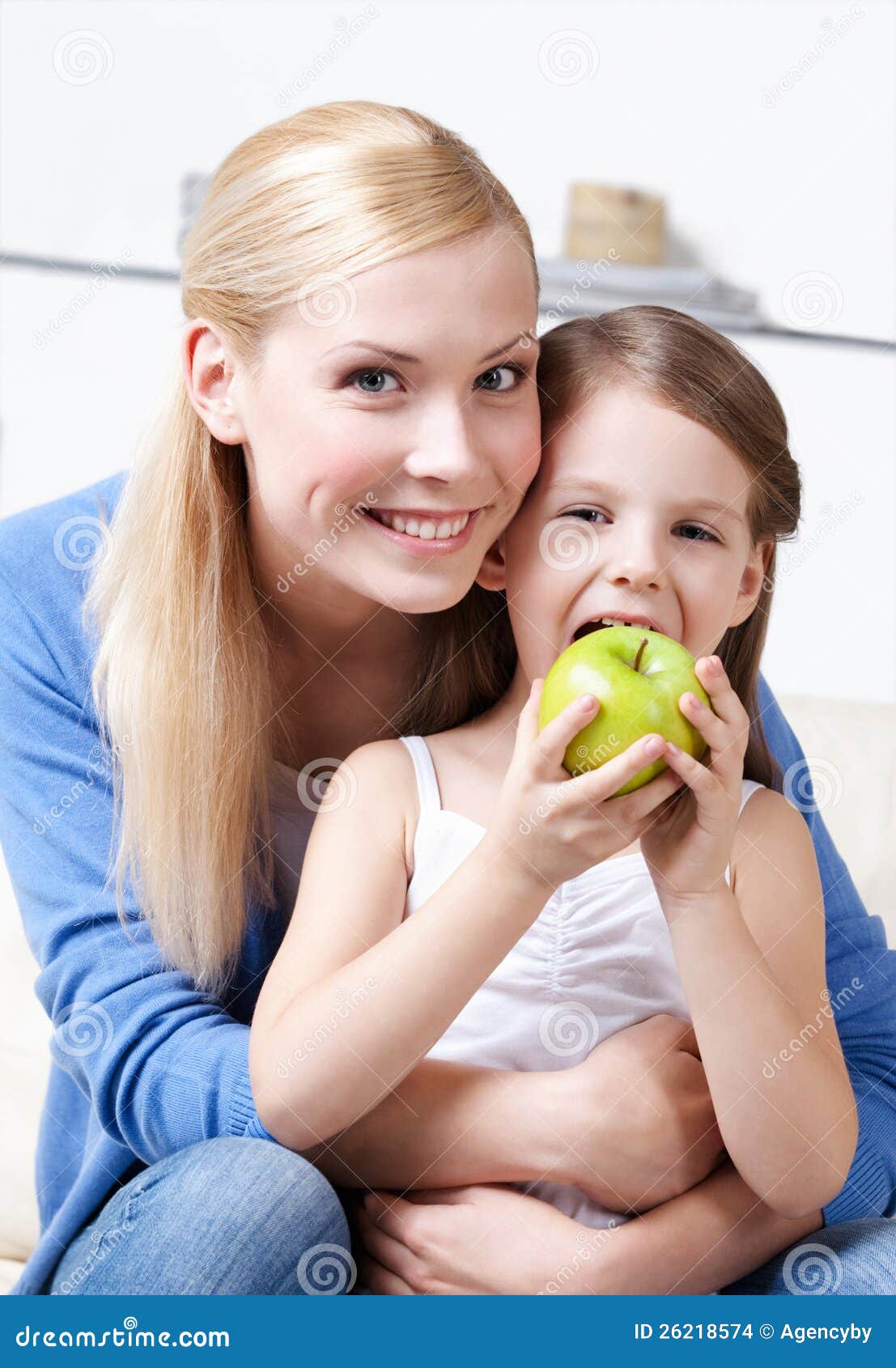 Smiley Mum with Her Eating Apple Daughter Stock Photo - Image of happy ...