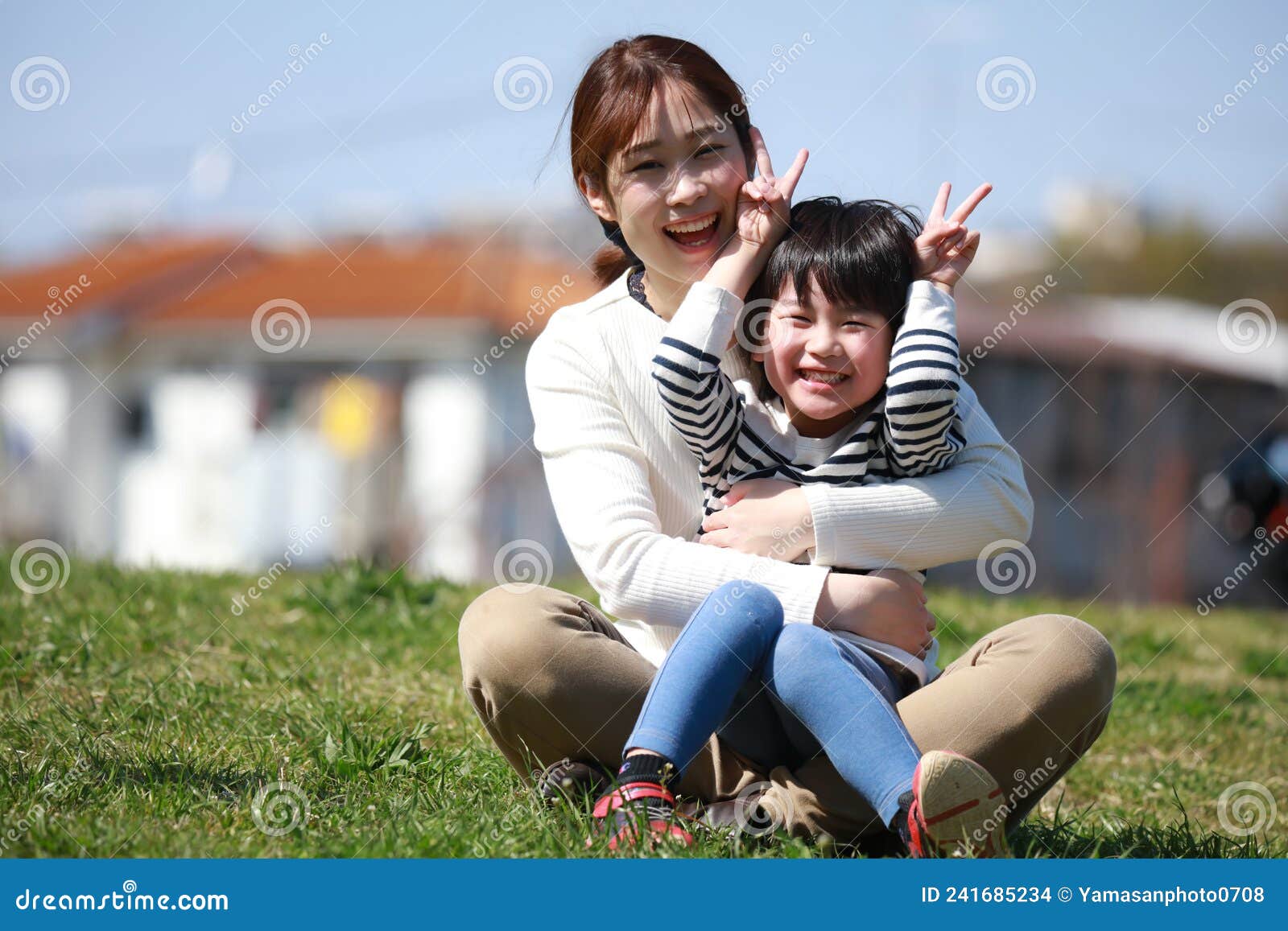Smiley parent and child stock photo. Image of child - 241685234