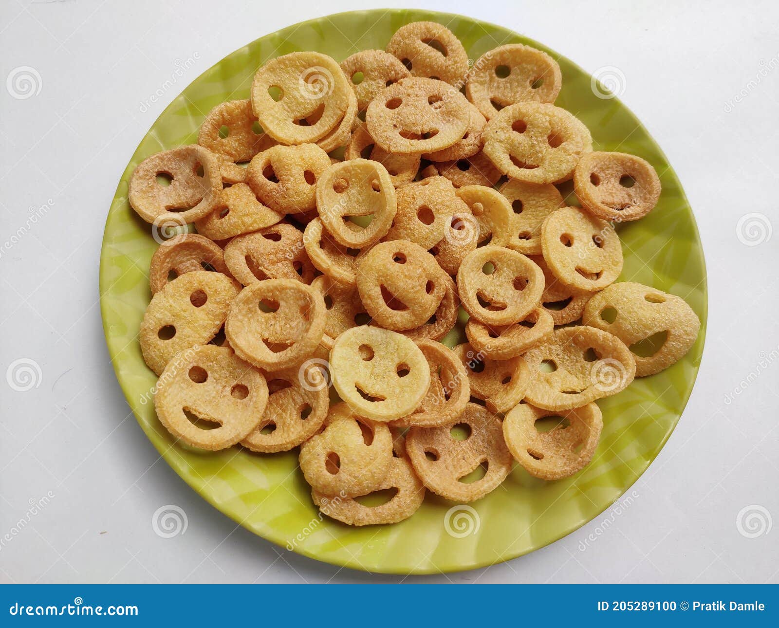 Smiley snacks on a plate stock photo. Image of brown - 205289100