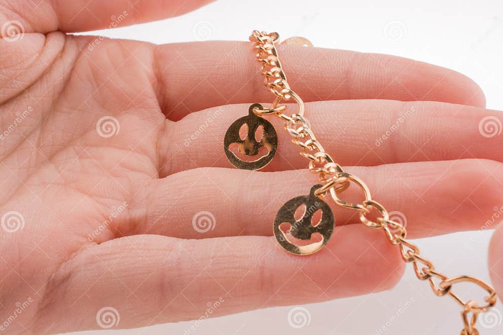 Smileys on a chain in hand stock photo. Image of chain - 144850522