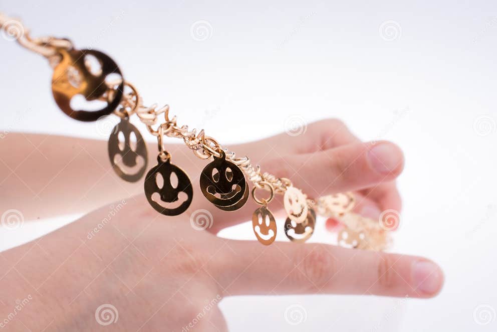 Smileys on a chain in hand stock photo. Image of emotion - 145799996