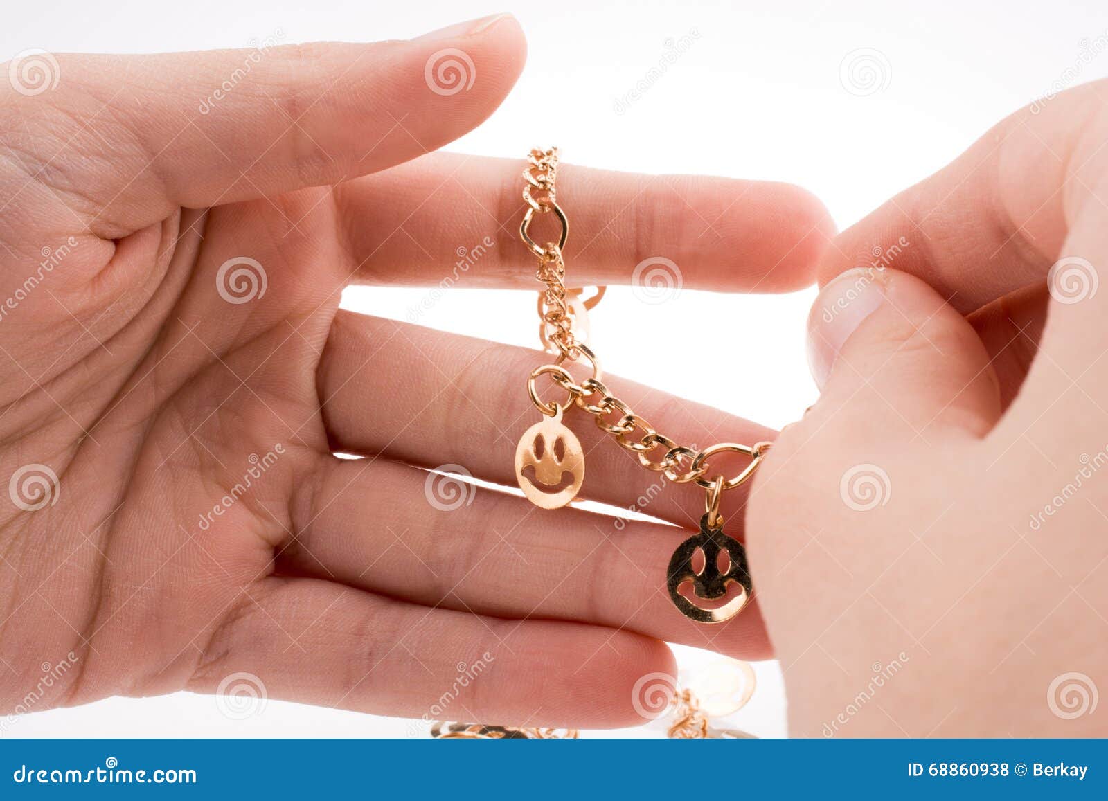 Smileys on a chain in hand stock photo. Image of happiness - 68860938