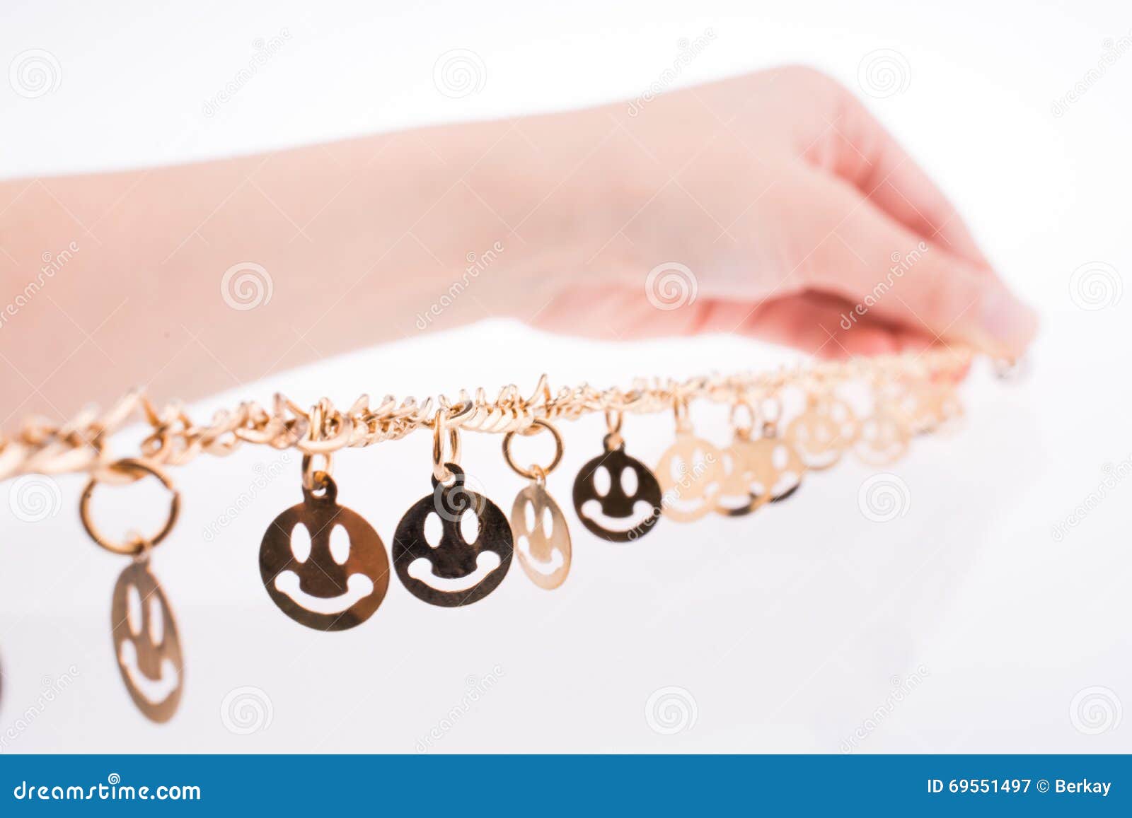 Smileys on a chain in hand stock image. Image of golden - 69551497