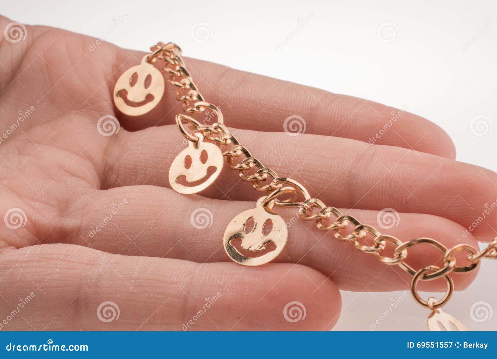 Smileys on a chain in hand stock image. Image of cute - 69551557
