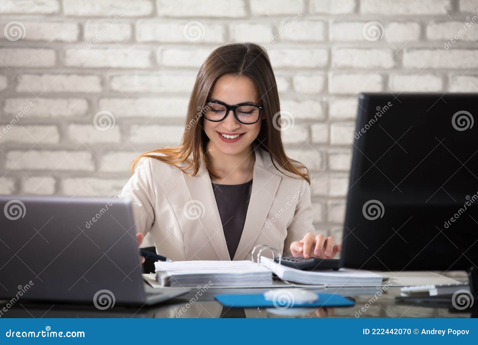 Smiling Accountant Using Calculator Stock Photo - Image of ...