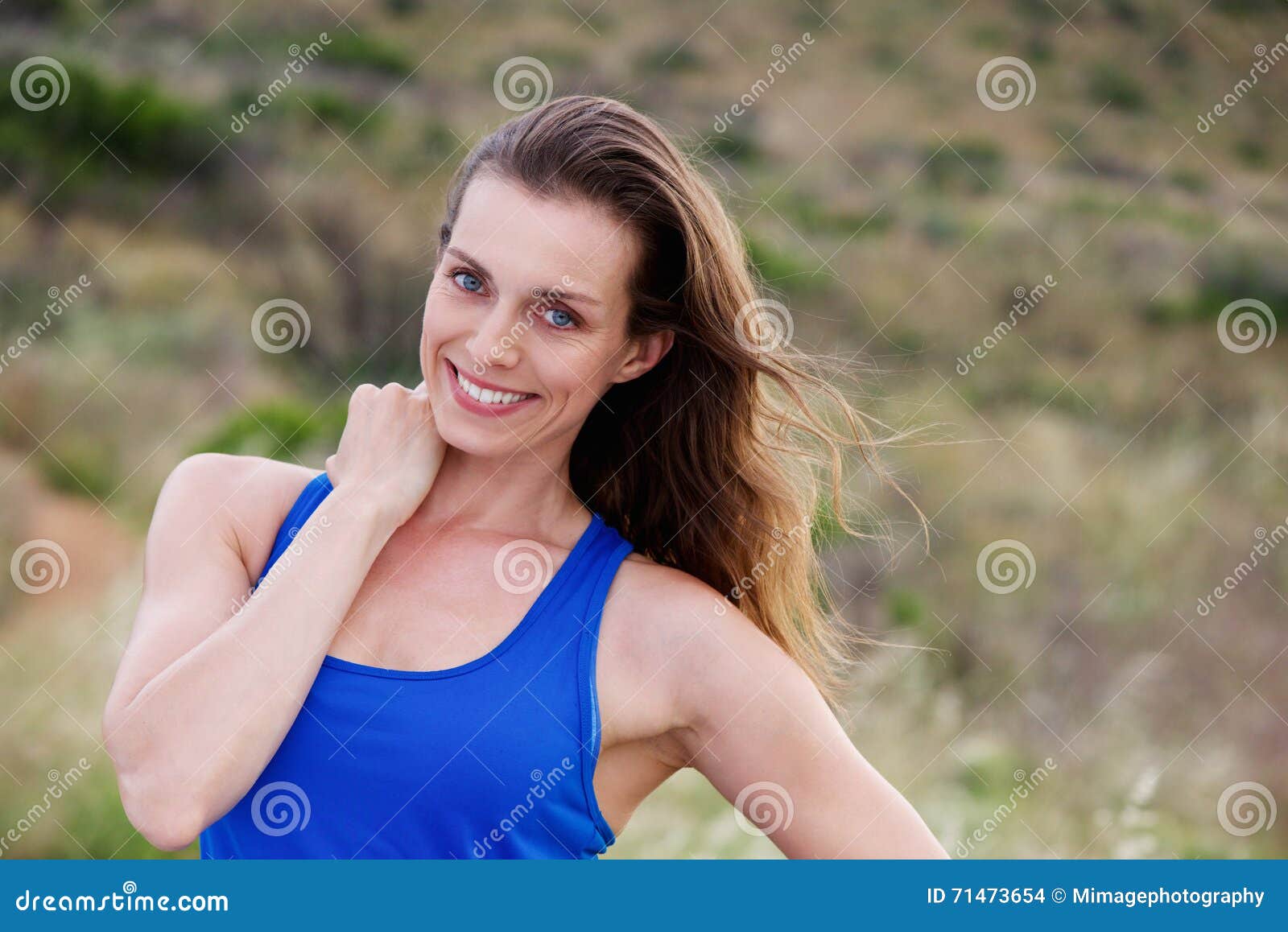 Smiling Active Woman Standing Outdoors Stock Photo - Image of freedom ...