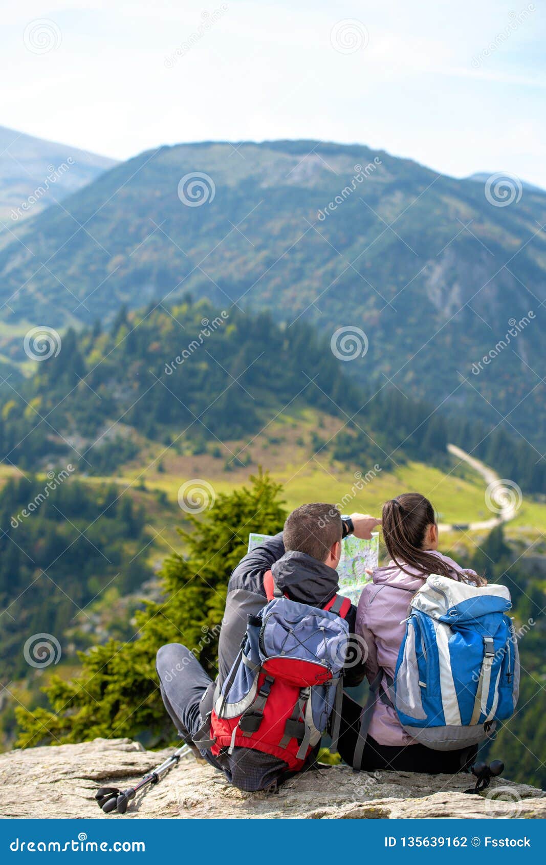 Smiling Adventure Couple with Map on Slope. Look at Map Stock Photo ...