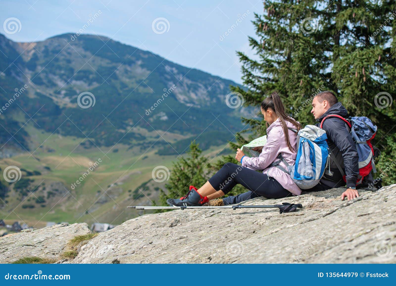 Smiling Adventure Couple with Map on Slope. Look at Map Stock Image ...
