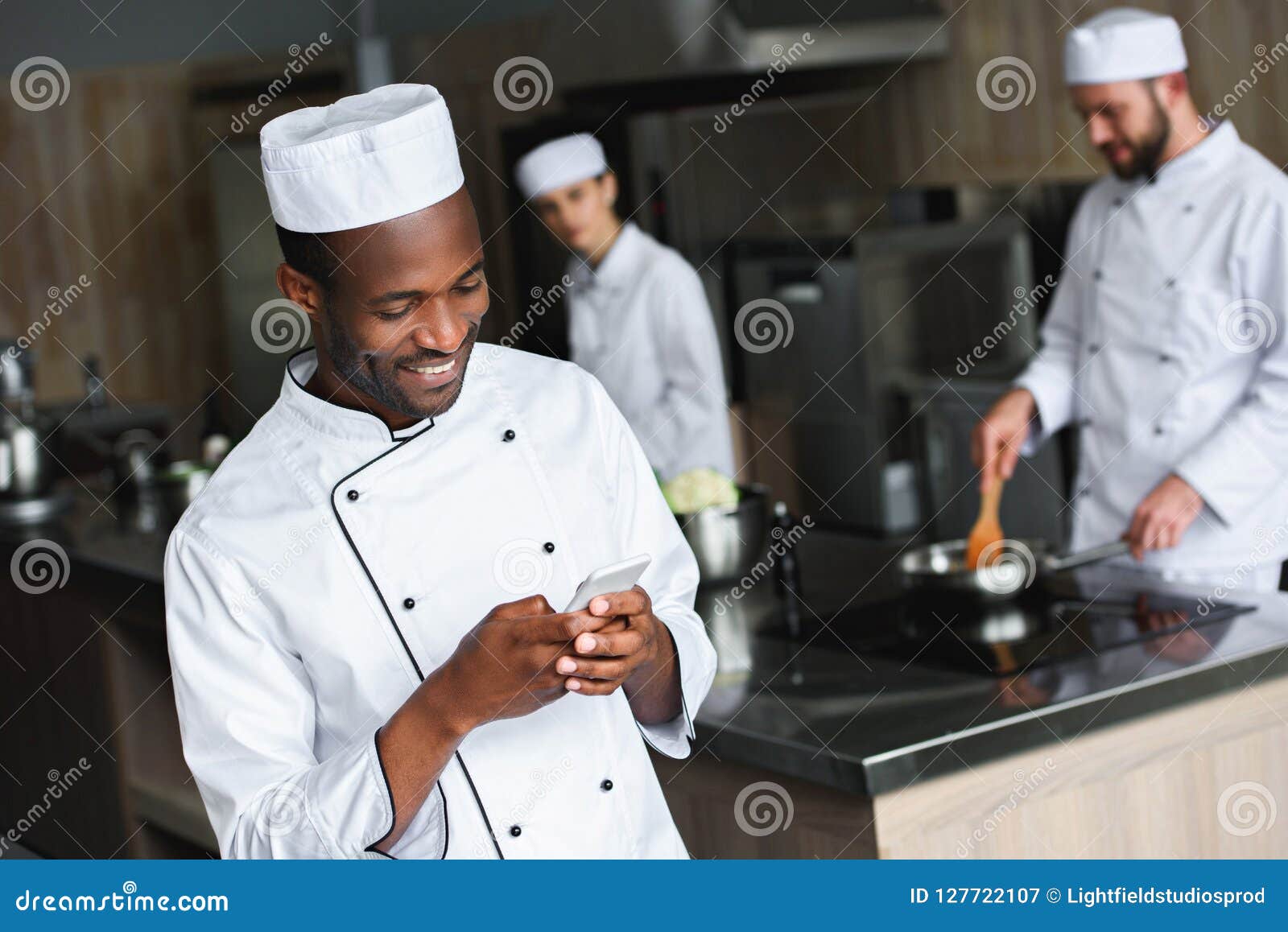 Smiling African American Chef Using Smartphone Stock Image - Image of ...