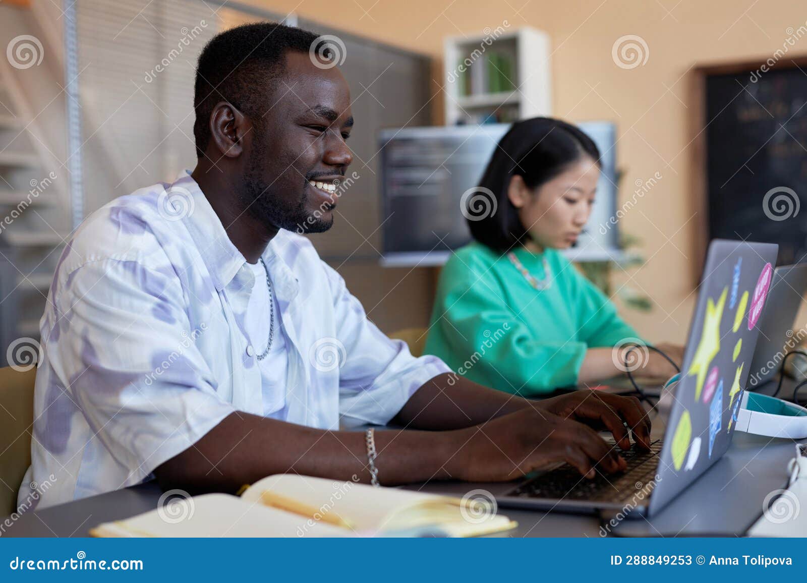 Smiling African American Guy Typing on Laptop Keyboard at Informatics ...