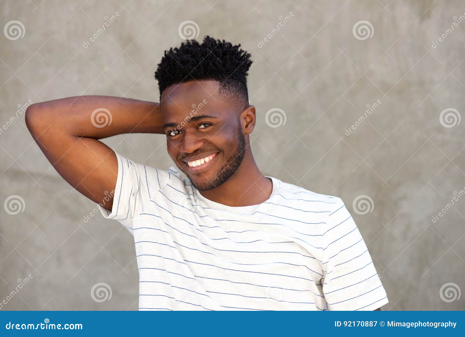 Smiling African Man with Hand Behind Head Stock Image - Image of male ...