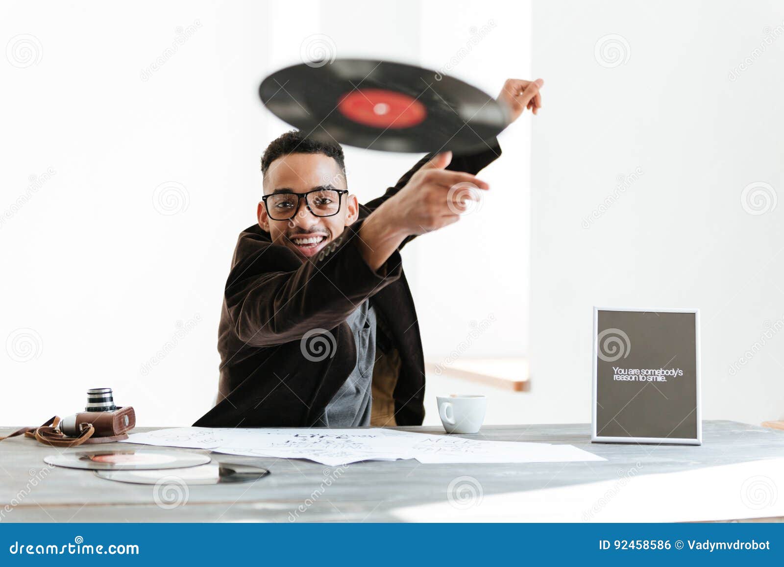 Smiling African Man Throwing Vinyl at Camera Stock Photo - Image of ...