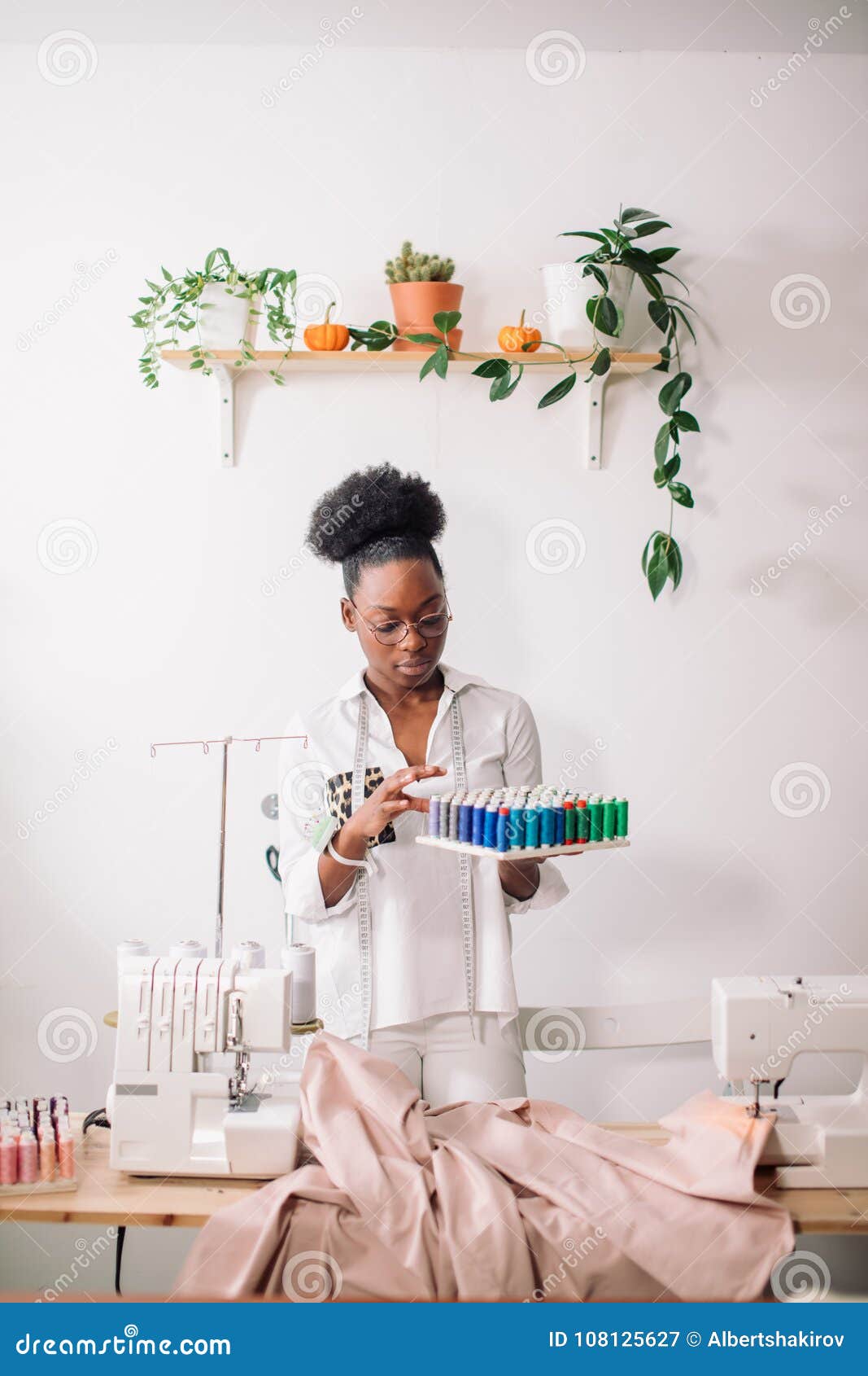 African Seamstress Holding Coils with Threads Stock Image - Image of ...